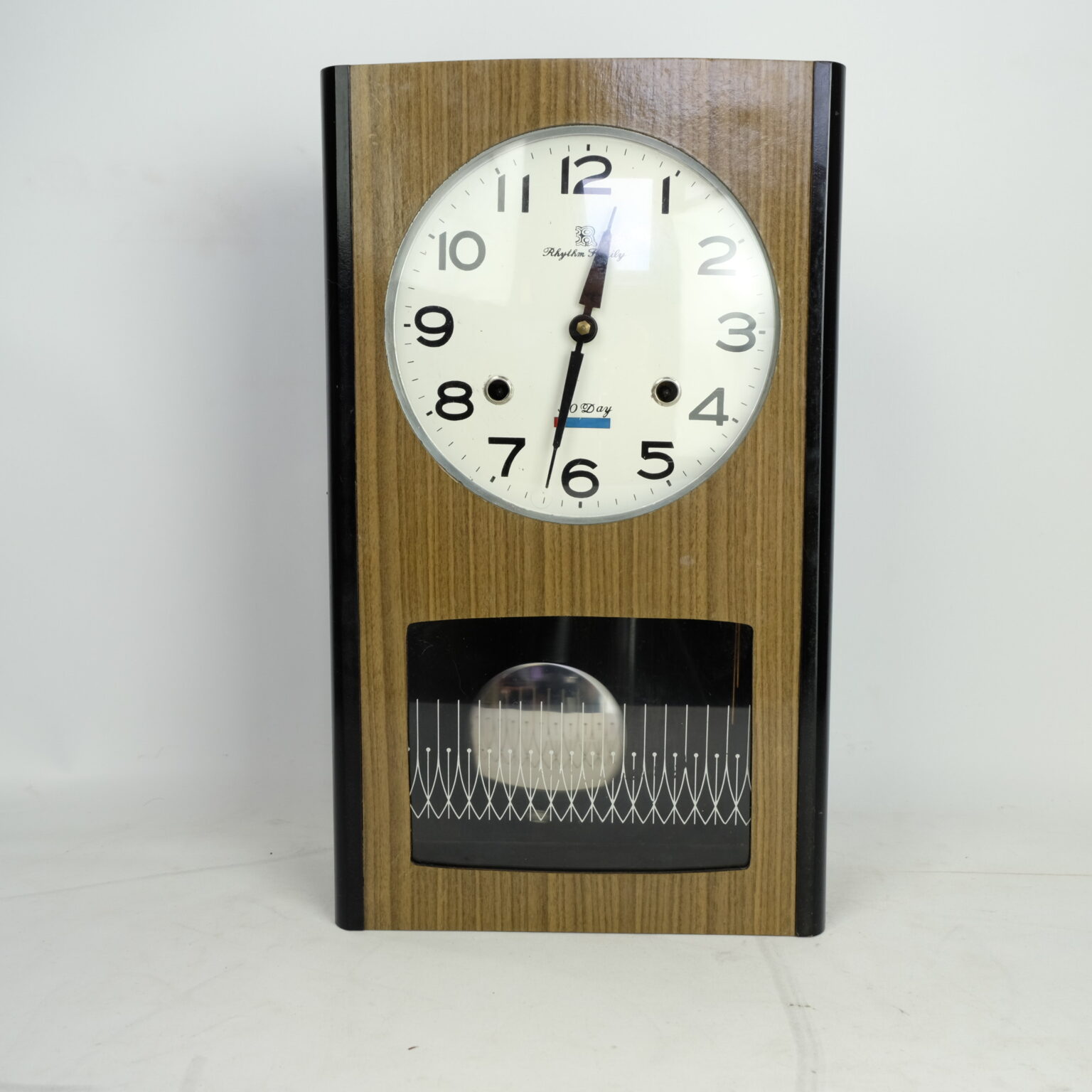 Rhythm Pendulum Wall Clock - Function In Form